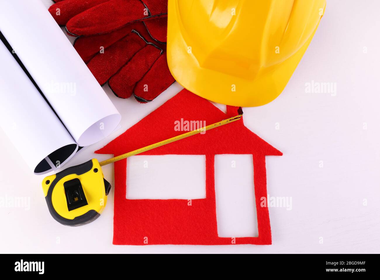 House of felt with helmet and gloves isolated on white Stock Photo - Alamy