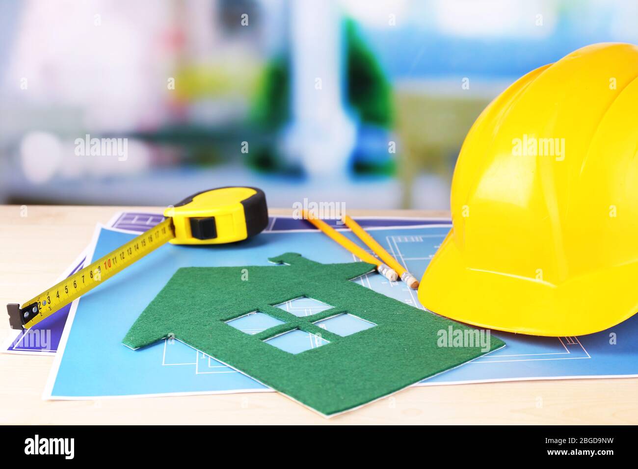 House of felt and drawings on table on bright background Stock Photo ...