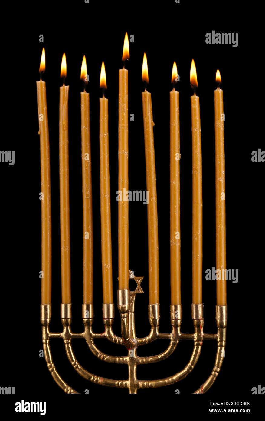 Candles burning on golden menorah hi-res stock photography and images ...