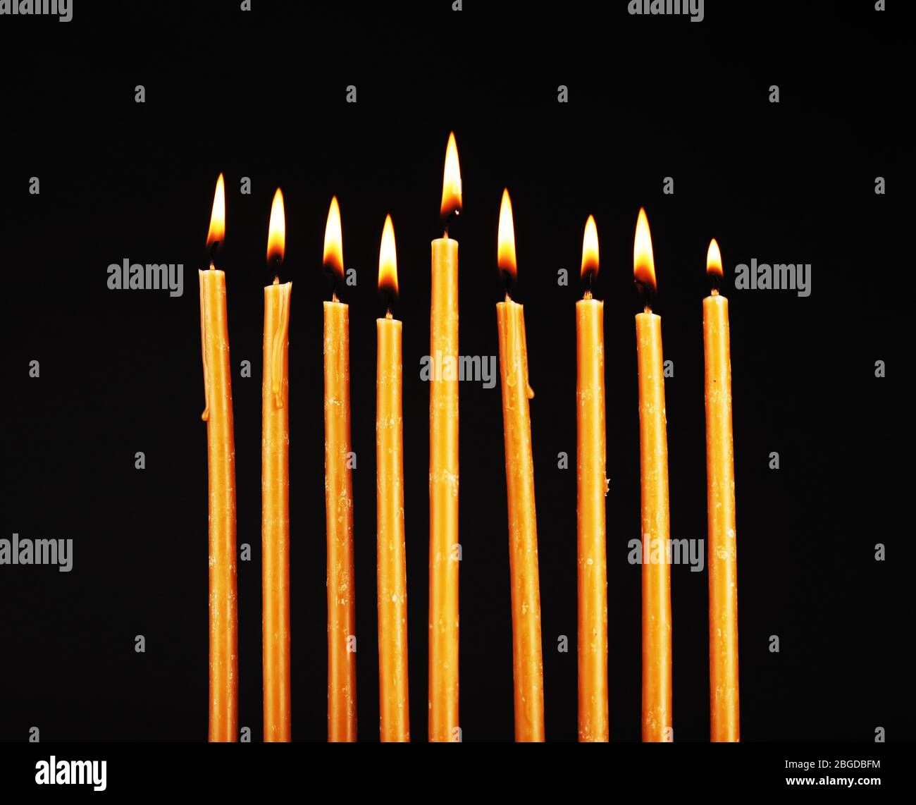 Candles burning on golden menorah hi-res stock photography and images ...