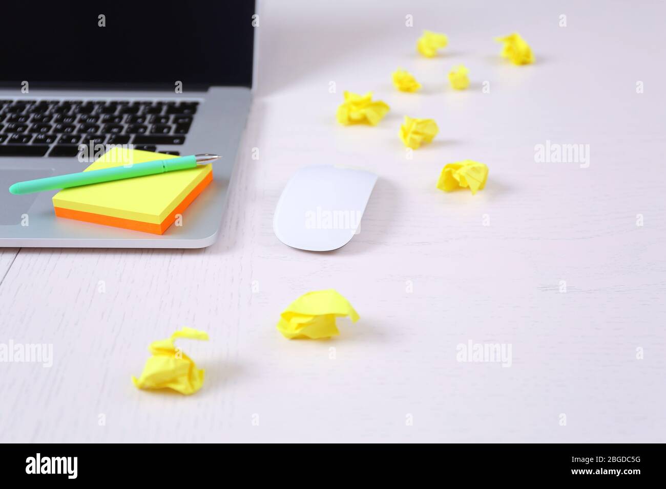 Office workplace with stickers and laptop on wooden desk Stock Photo ...