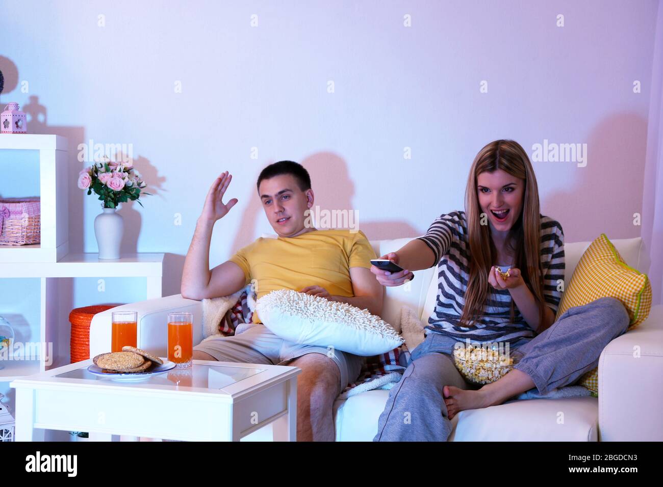 Young couple watching television at home of blacking-out Stock Photo ...