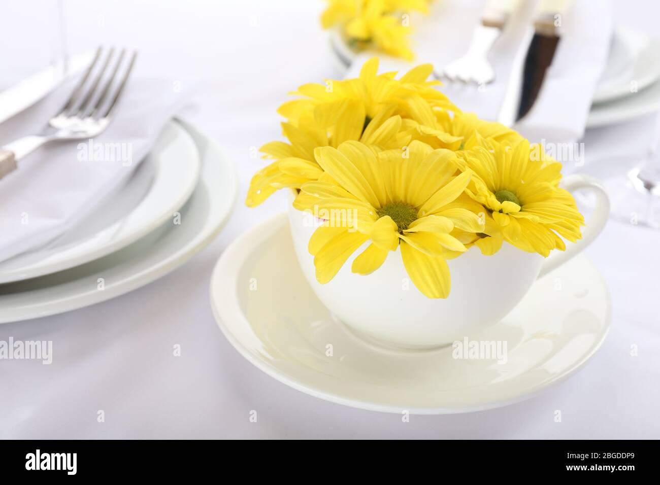 Table setting with spring flowers close up Stock Photo - Alamy