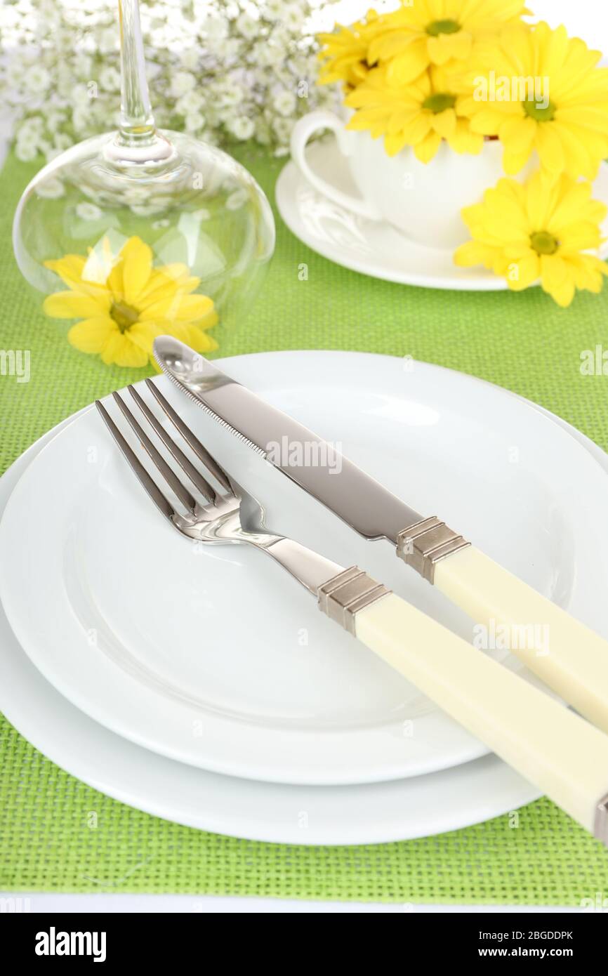 Table setting with spring flowers close up Stock Photo - Alamy