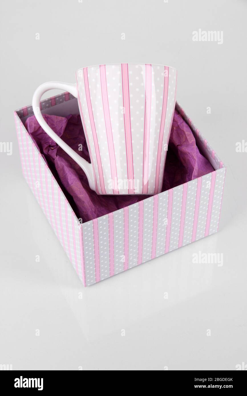 Cup in box close-up isolated on white Stock Photo - Alamy