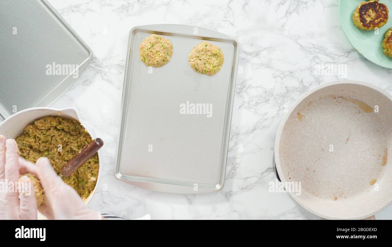 Flat lay. Step by step. Shaping patties of zucchini cakes to fry on a ...