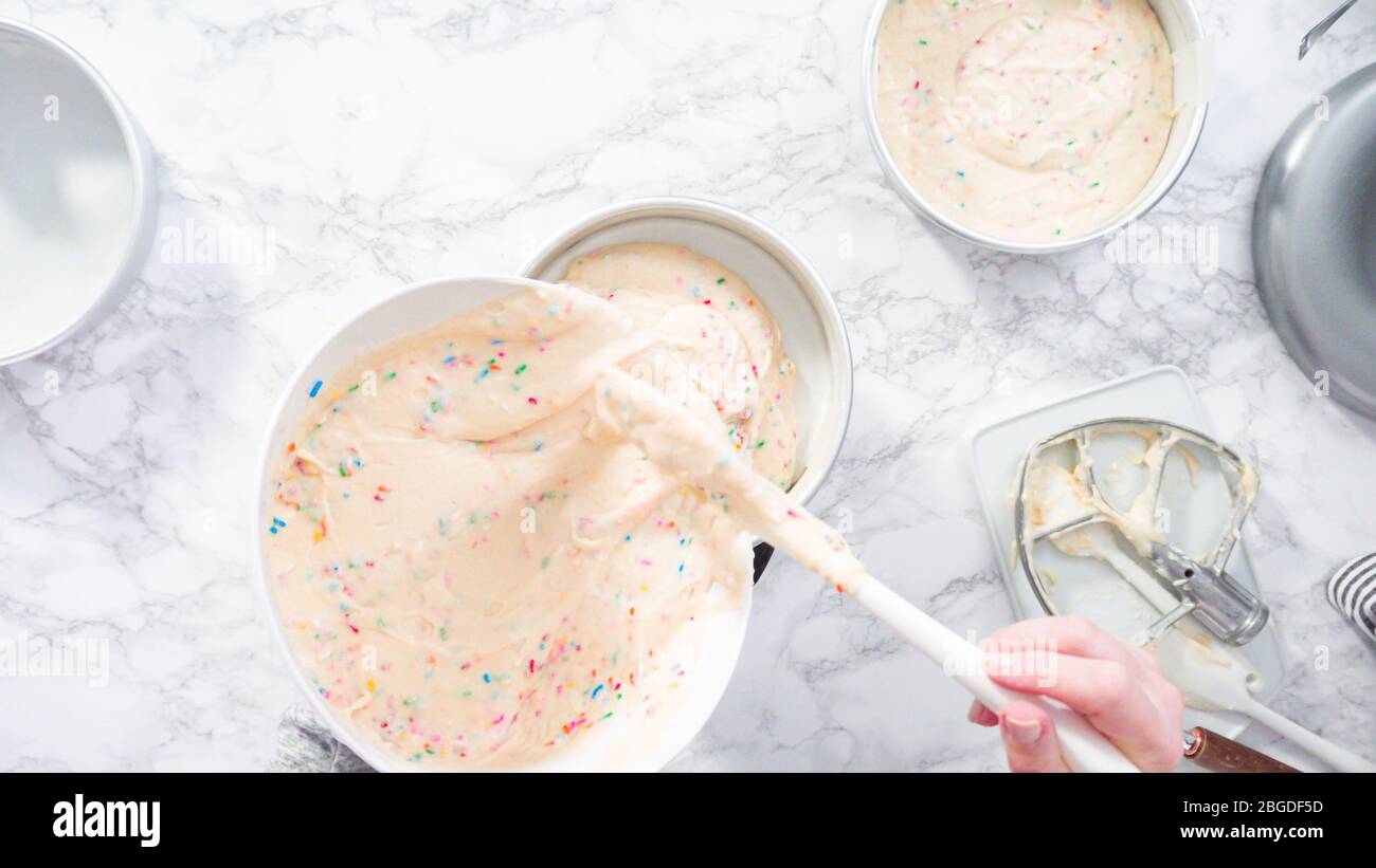 Flat lay. Step by step. Measuring funfetti cake batter on a digital ...