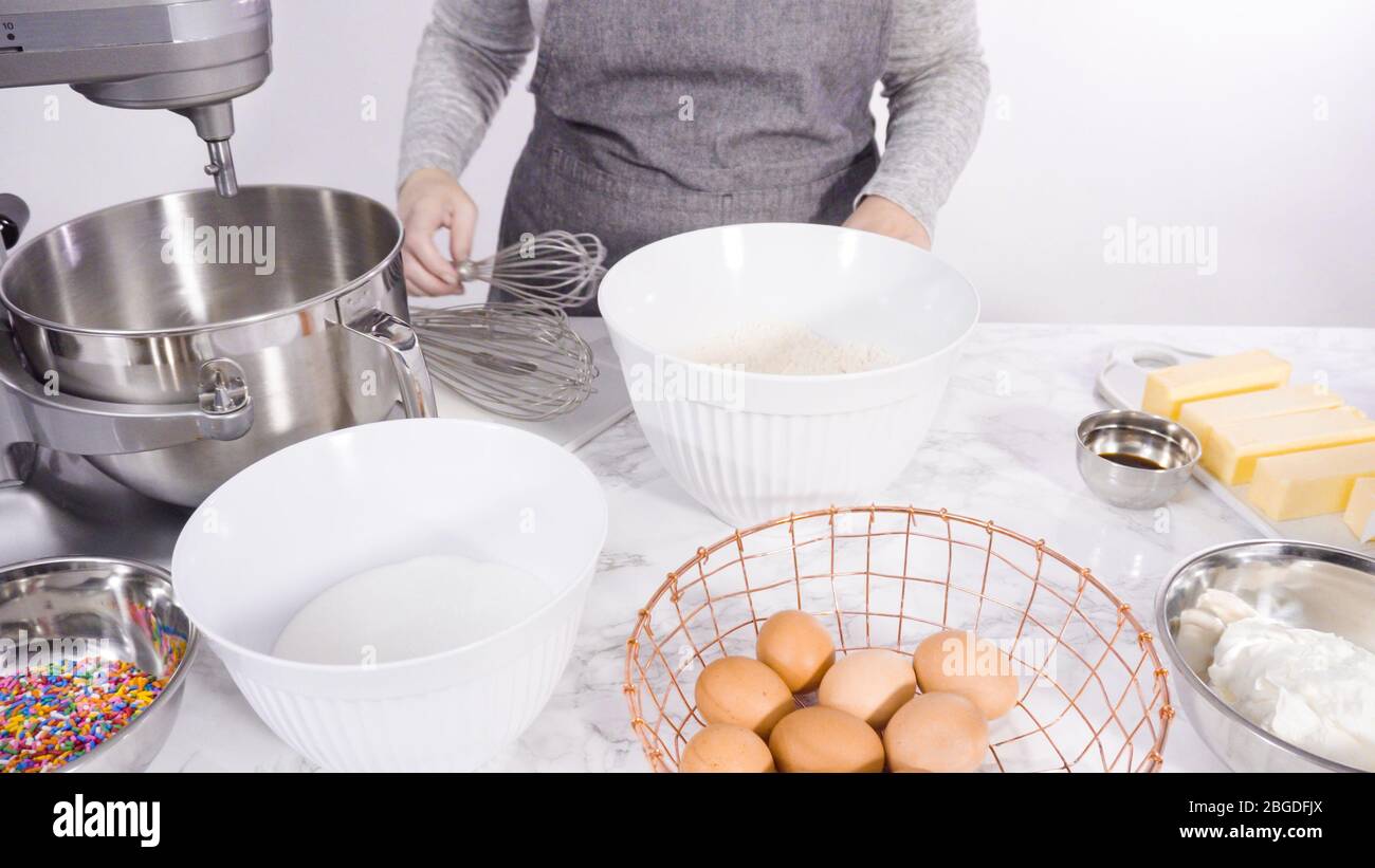 Step by step. Mixing ingredients in standing kitchen mixer to bake ...