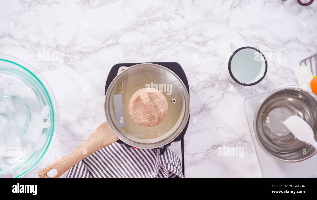 Flat lay. Step by step. Caramelizing sugar in a small cooking pot over ...