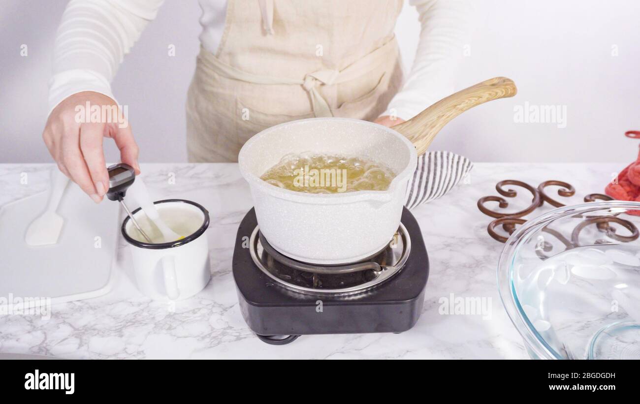 Step by step. Caramelizing sugar in a small cooking pot over the small ...