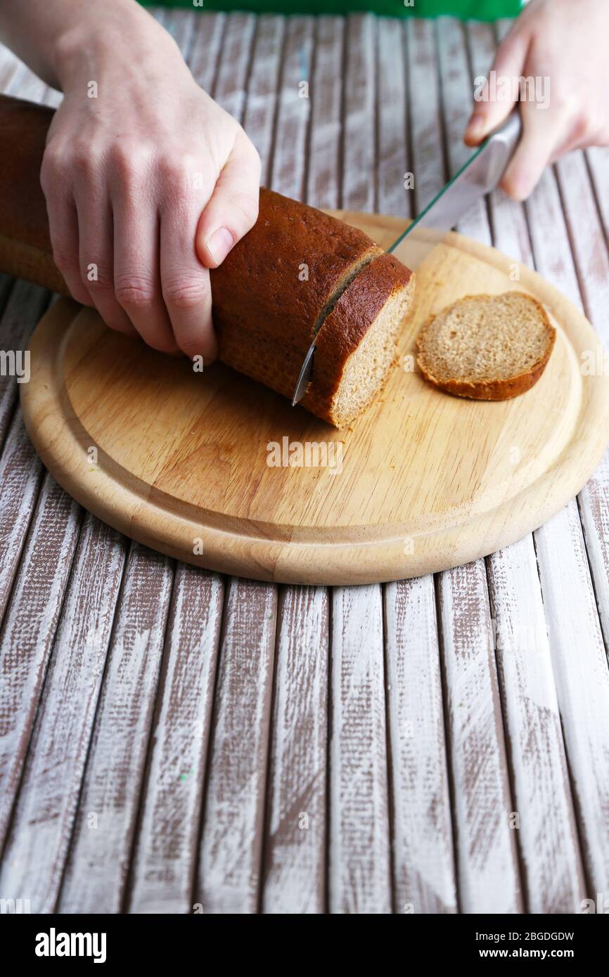 Women hands cutting bakery hi-res stock photography and images - Alamy