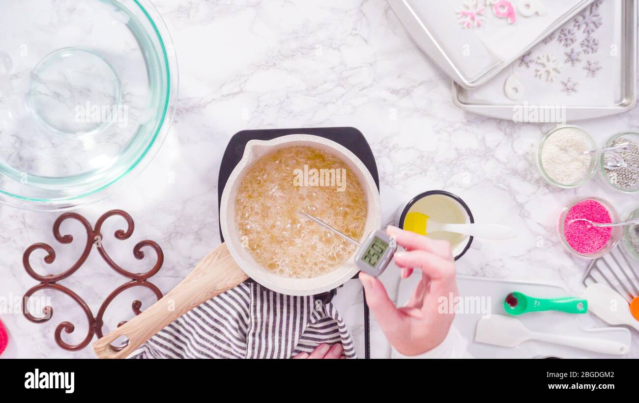 Flat lay. Step by step. Caramelizing sugar in a small cooking pot over ...