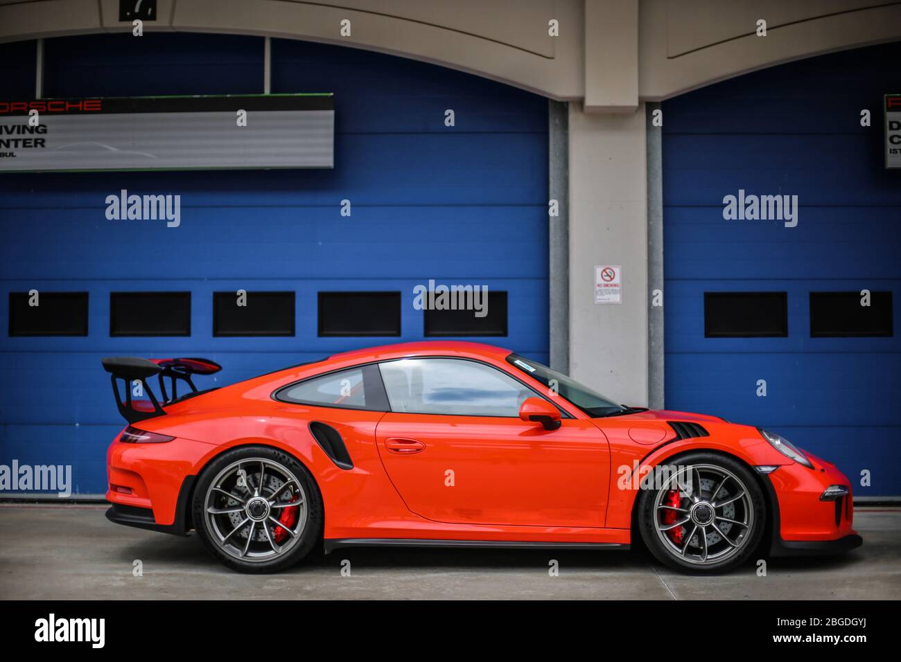 Orange color racing cars on the rally track in the stadium Stock Photo ...