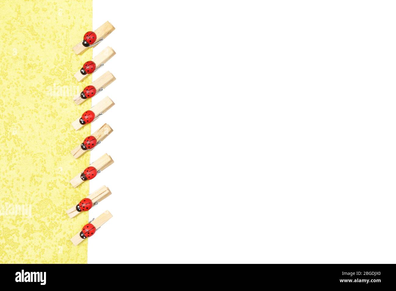 Colorful wooden pins with paper, isolated on white Stock Photo - Alamy