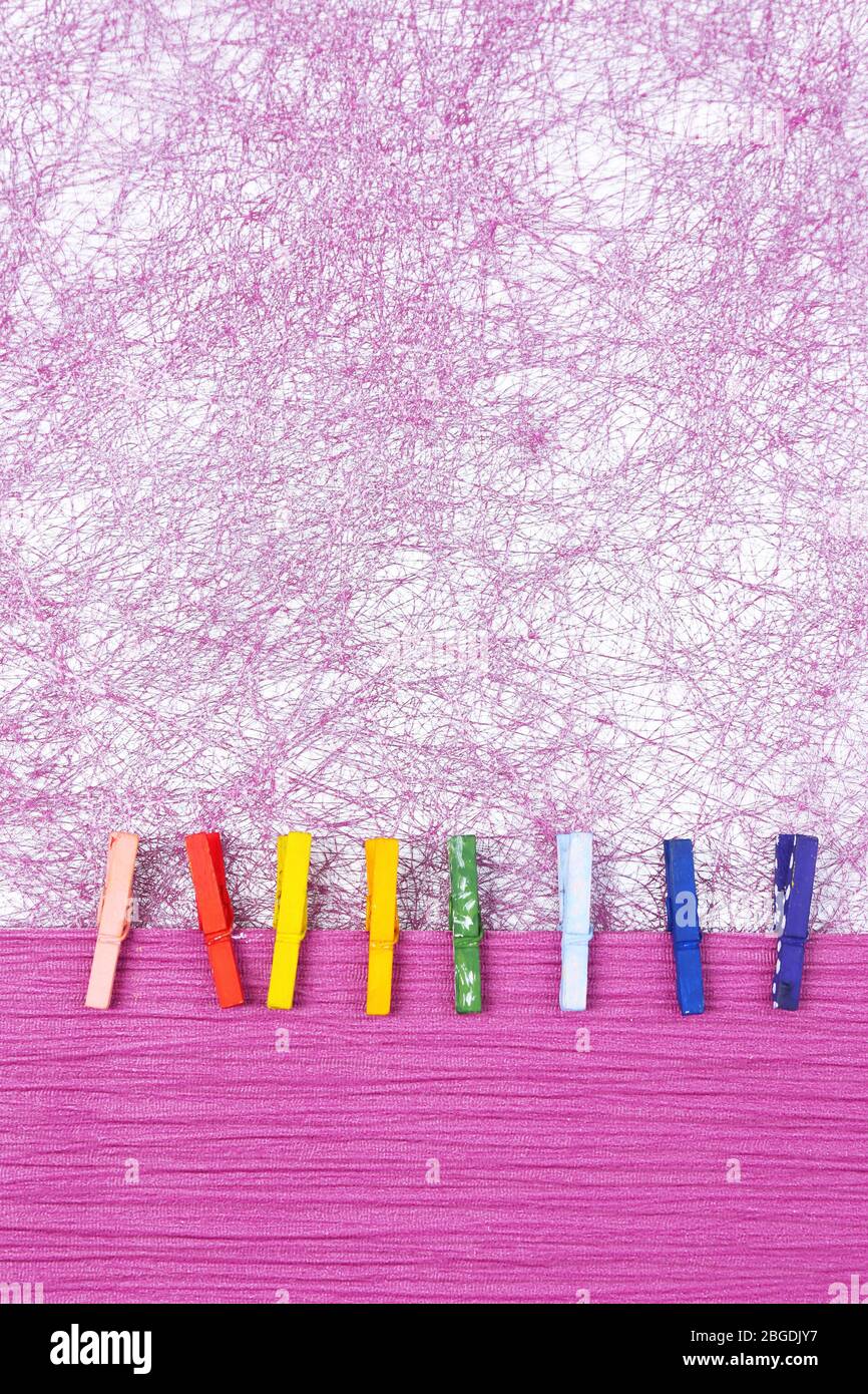 Abstract background with colorful wooden pins and paper Stock Photo - Alamy