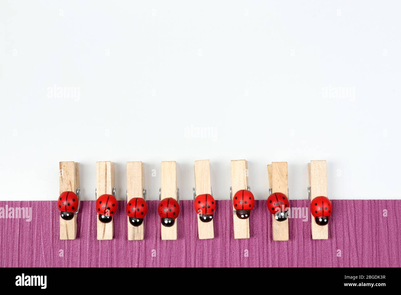 Abstract background with colorful wooden pins and paper Stock Photo - Alamy