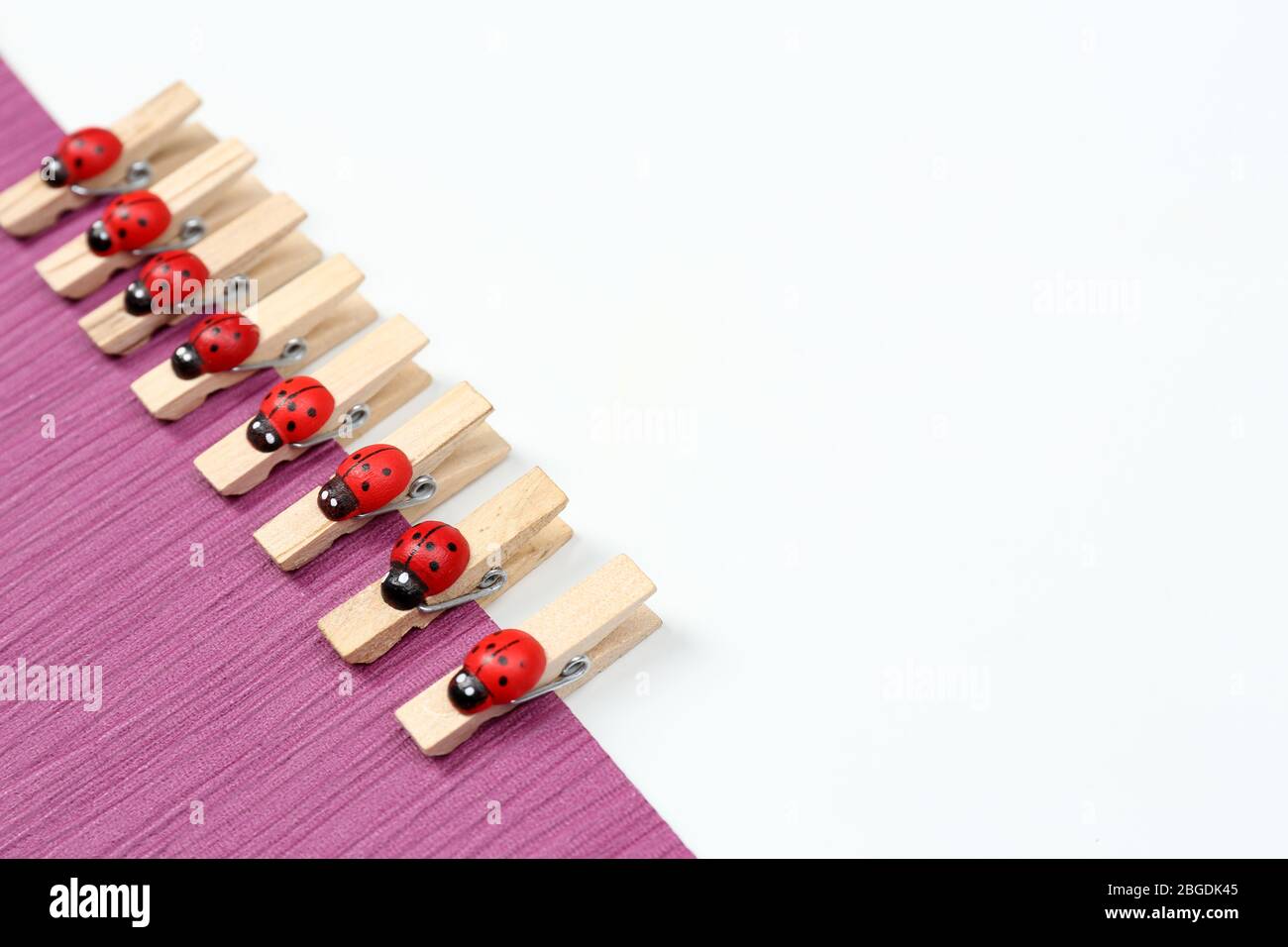 Abstract background with colorful wooden pins and paper Stock Photo - Alamy
