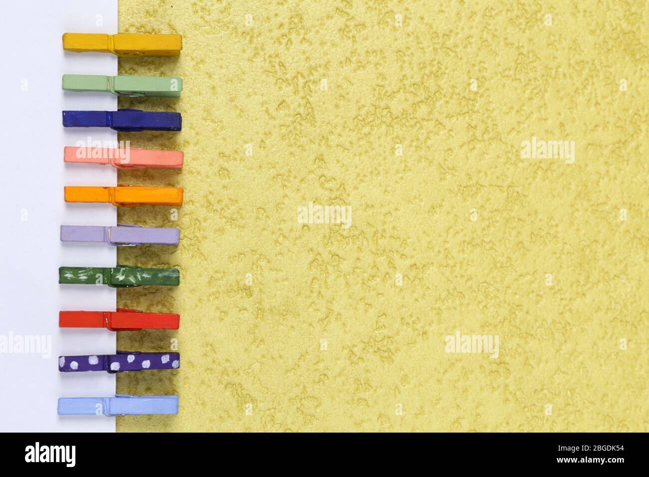 Abstract background with colorful wooden pins and paper Stock Photo - Alamy