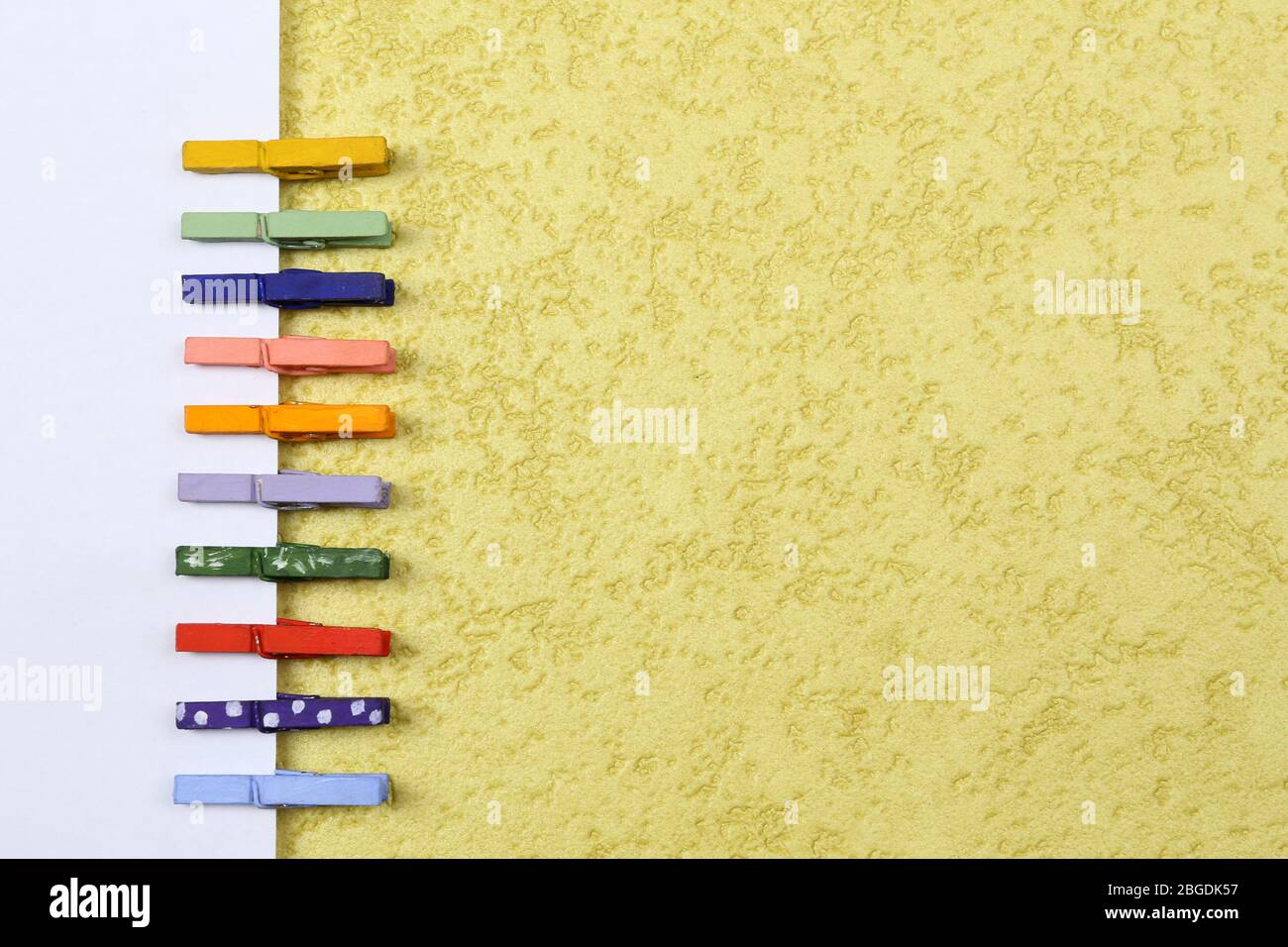 Abstract background with colorful wooden pins and paper Stock Photo - Alamy