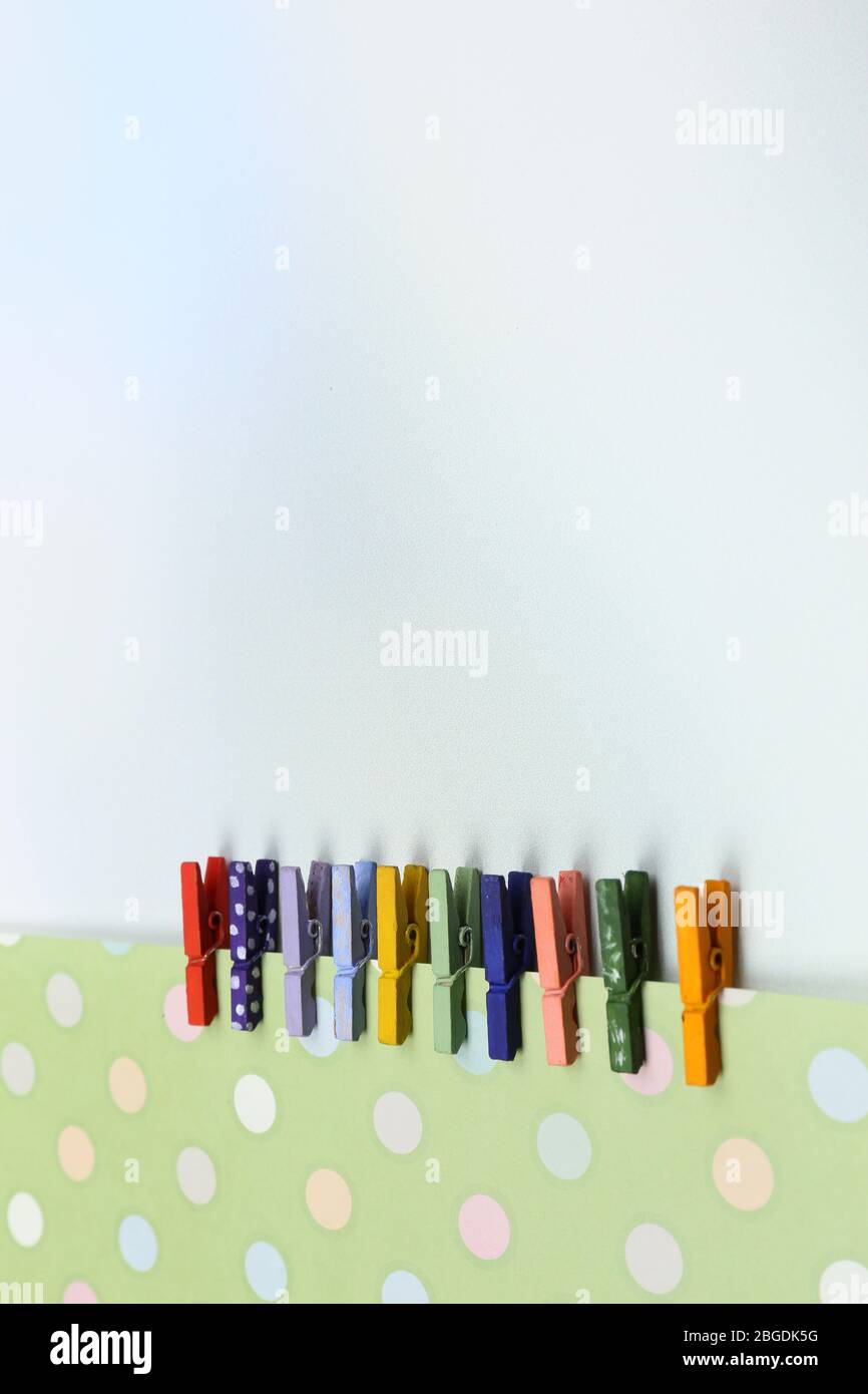 Abstract background with colorful wooden pins and paper Stock Photo - Alamy