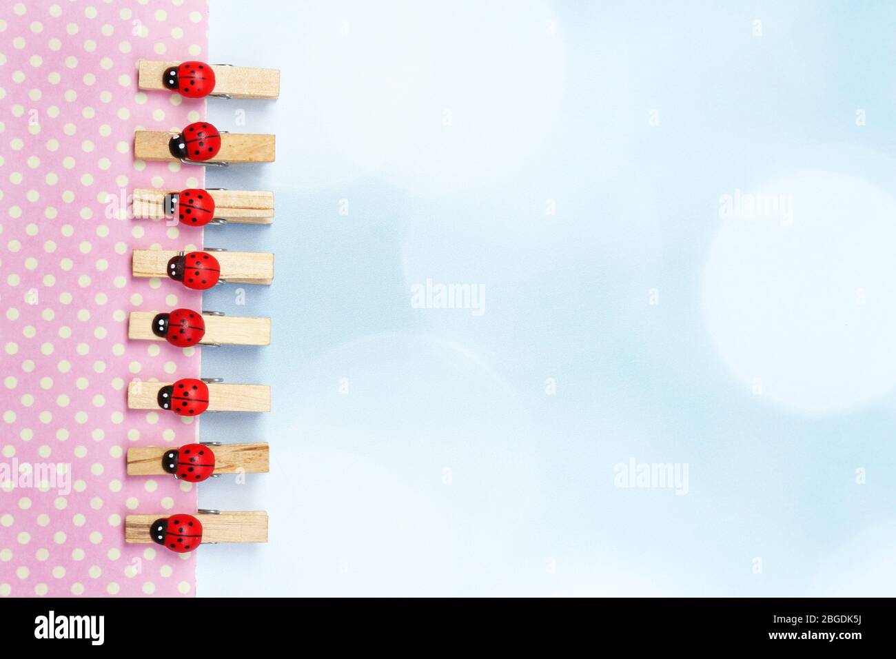 Abstract background with colorful wooden pins and paper Stock Photo - Alamy