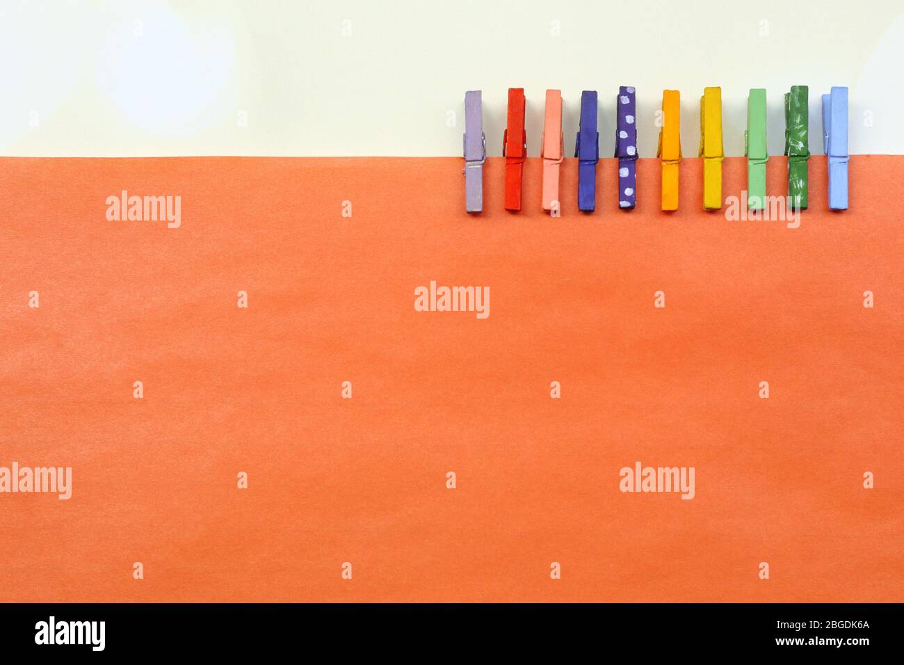 Abstract background with colorful wooden pins and paper Stock Photo - Alamy