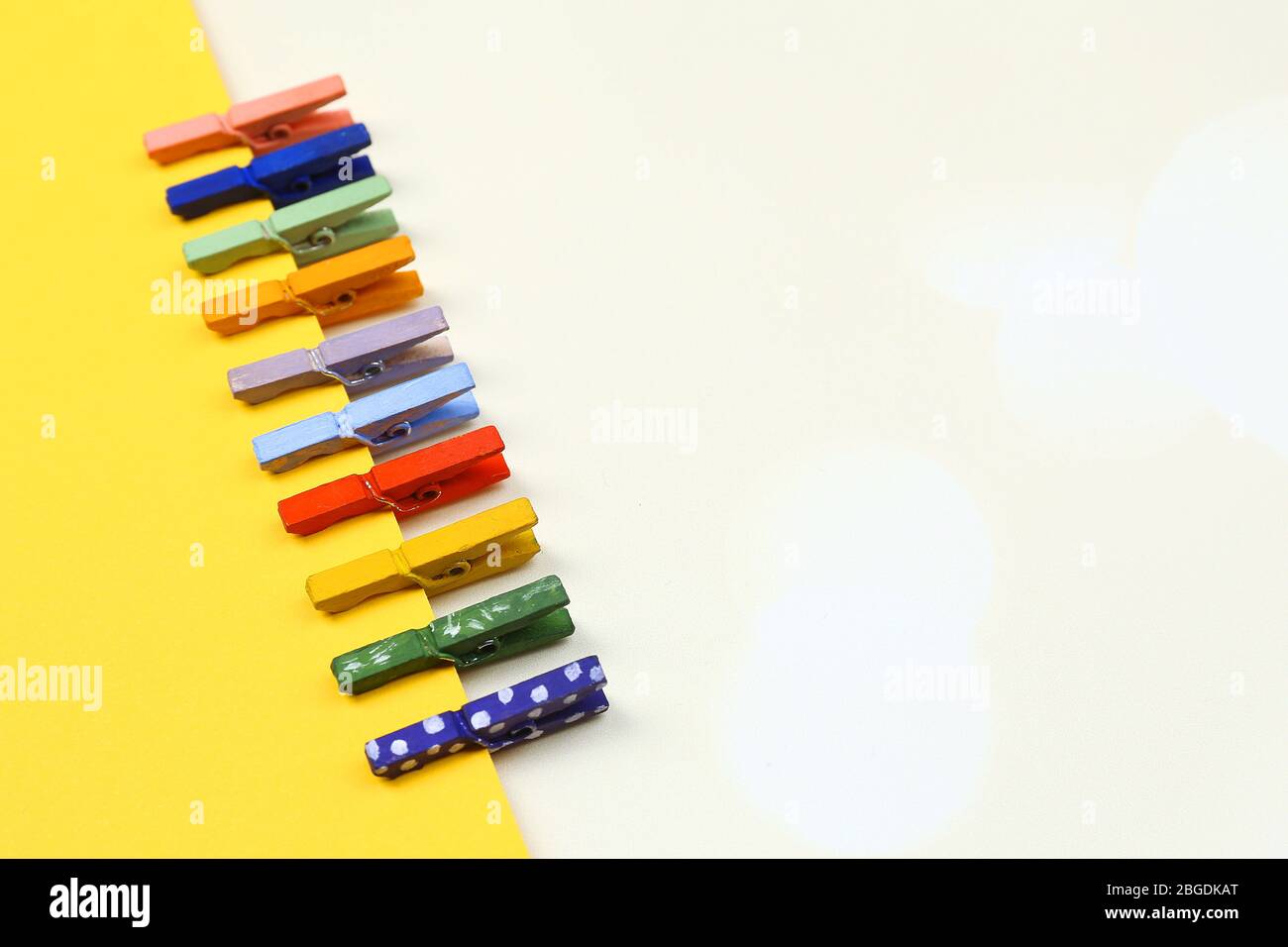 Abstract background with colorful wooden pins and paper Stock Photo - Alamy