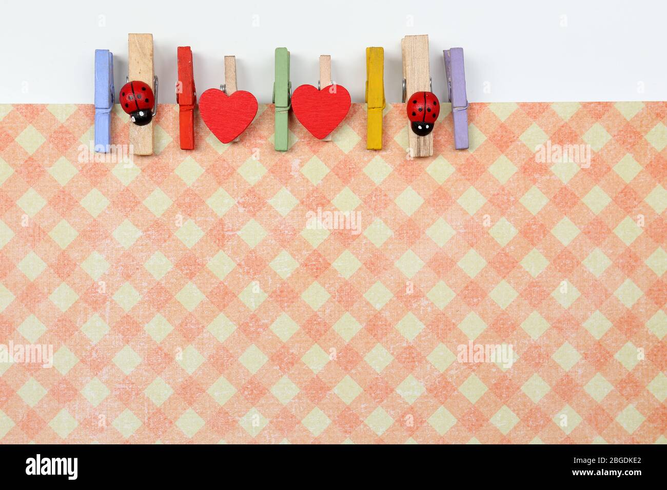 Abstract background with colorful wooden pins and paper Stock Photo - Alamy