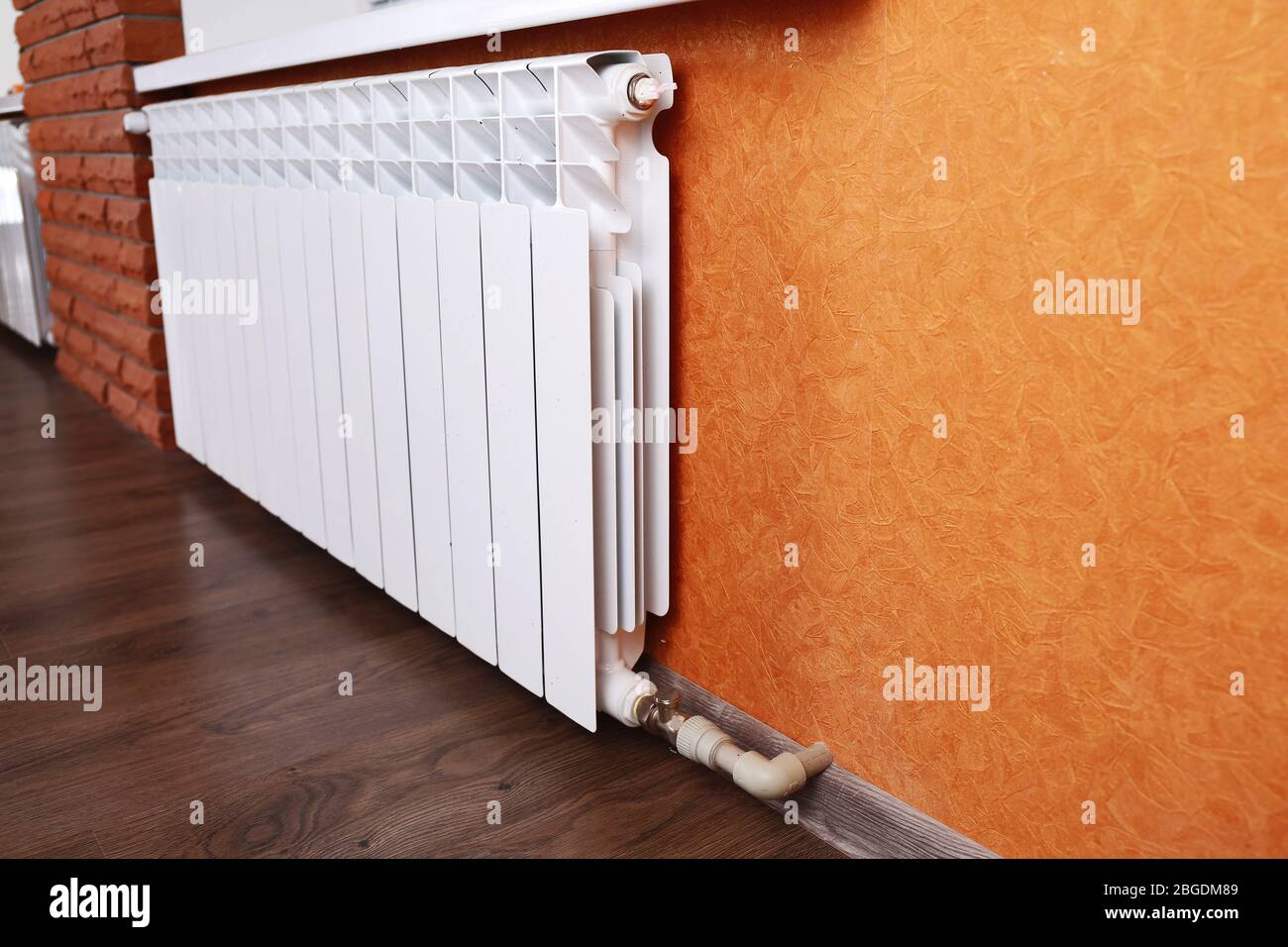 Heating radiator in room Stock Photo - Alamy
