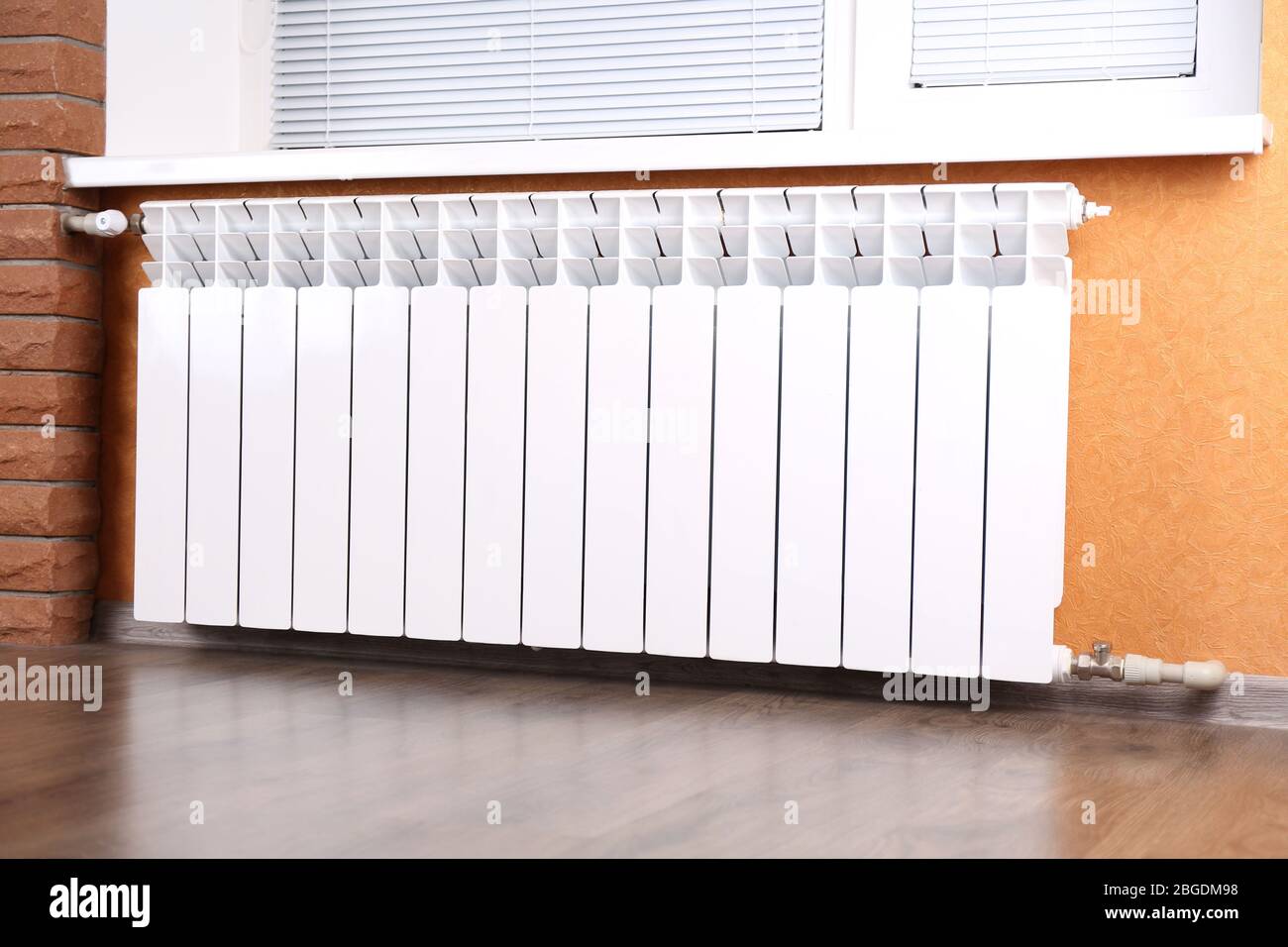 Heating radiator in room Stock Photo - Alamy