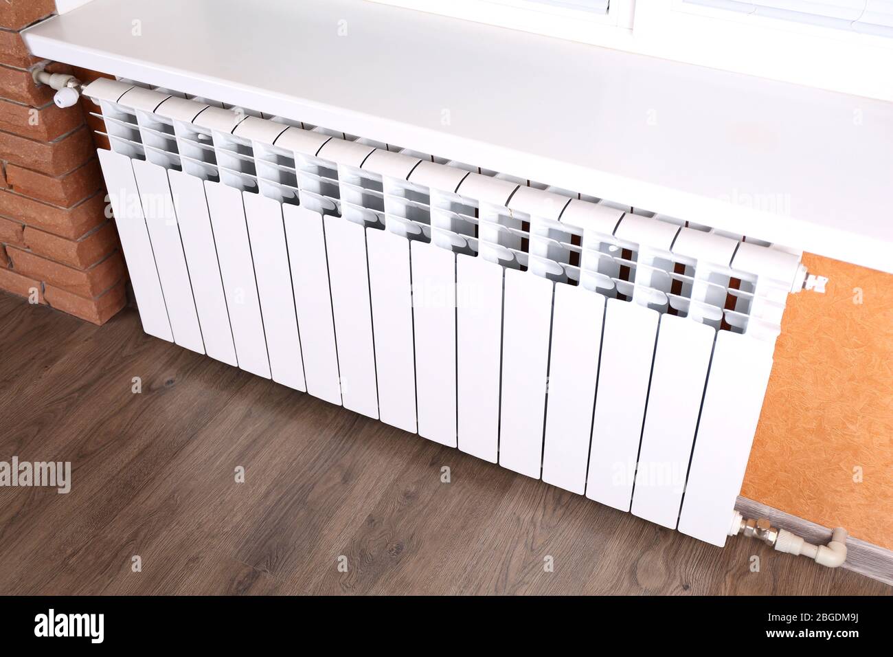 Heating radiator in room Stock Photo - Alamy