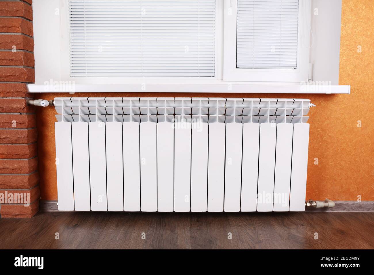 Heating radiator in room Stock Photo - Alamy
