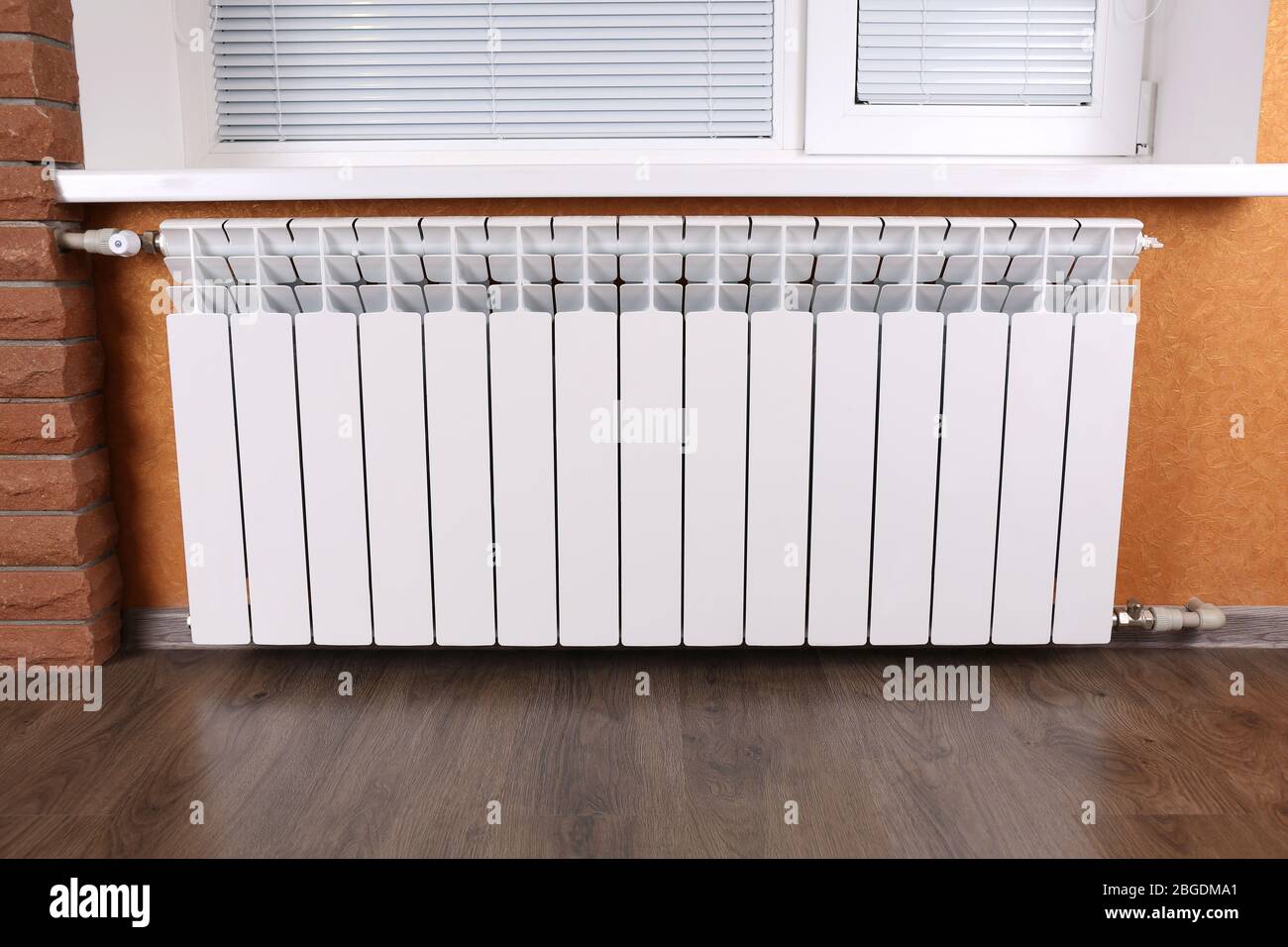 Heating radiator in room Stock Photo - Alamy