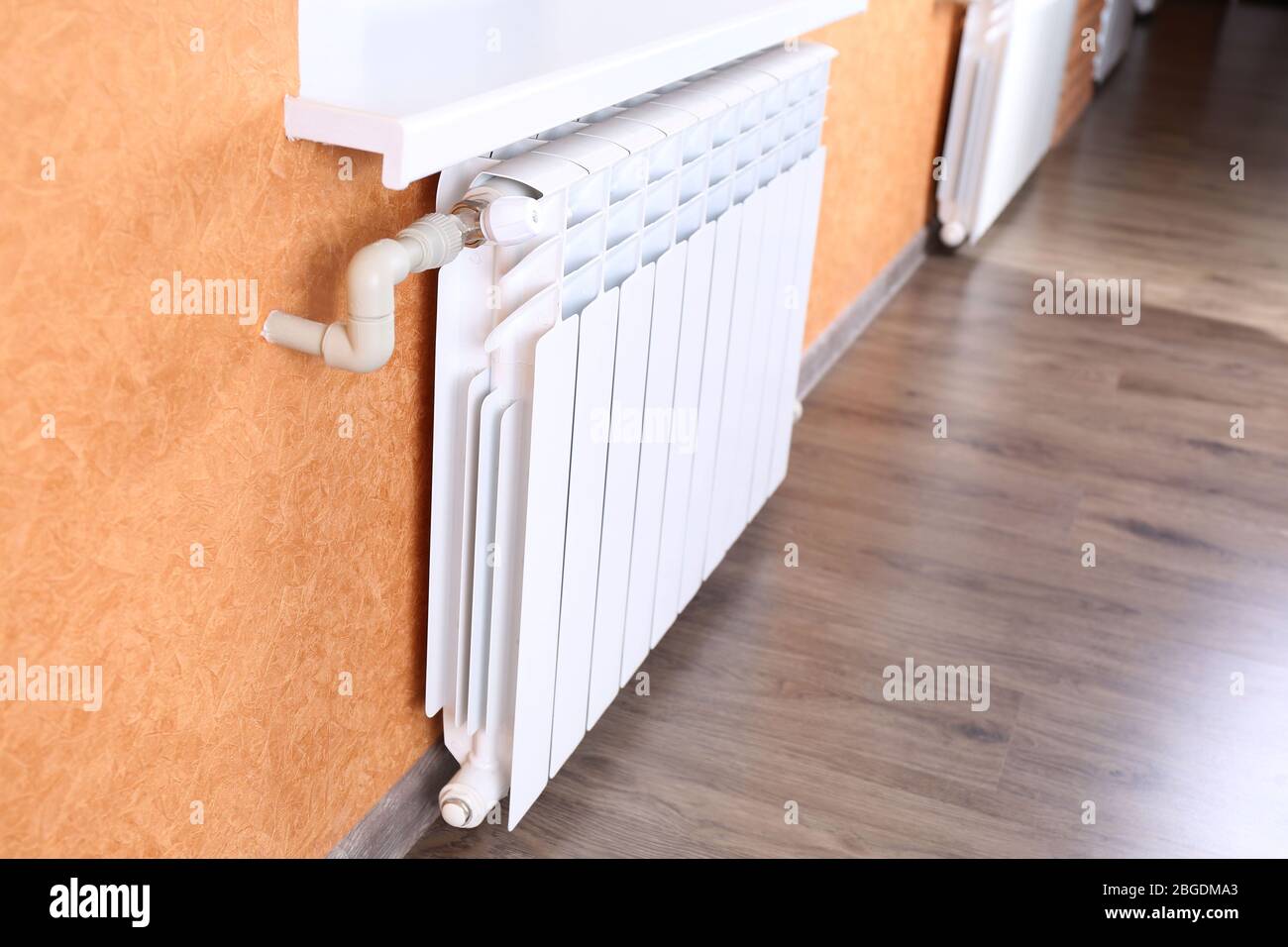Heating radiator in room Stock Photo - Alamy