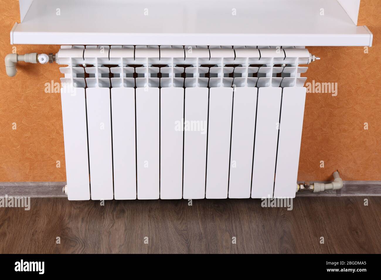 Heating radiator in room Stock Photo - Alamy