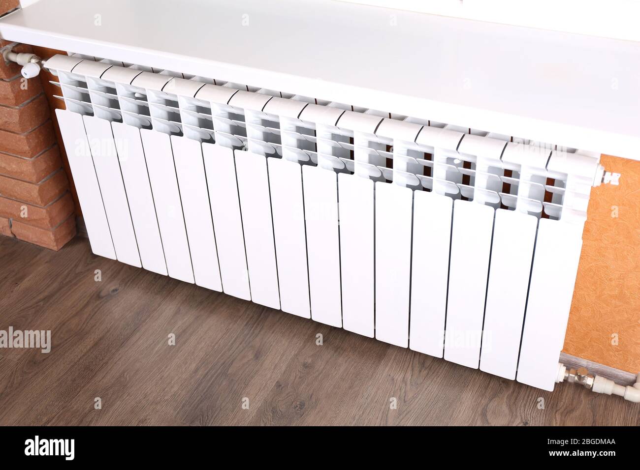 Heating radiator in room Stock Photo - Alamy