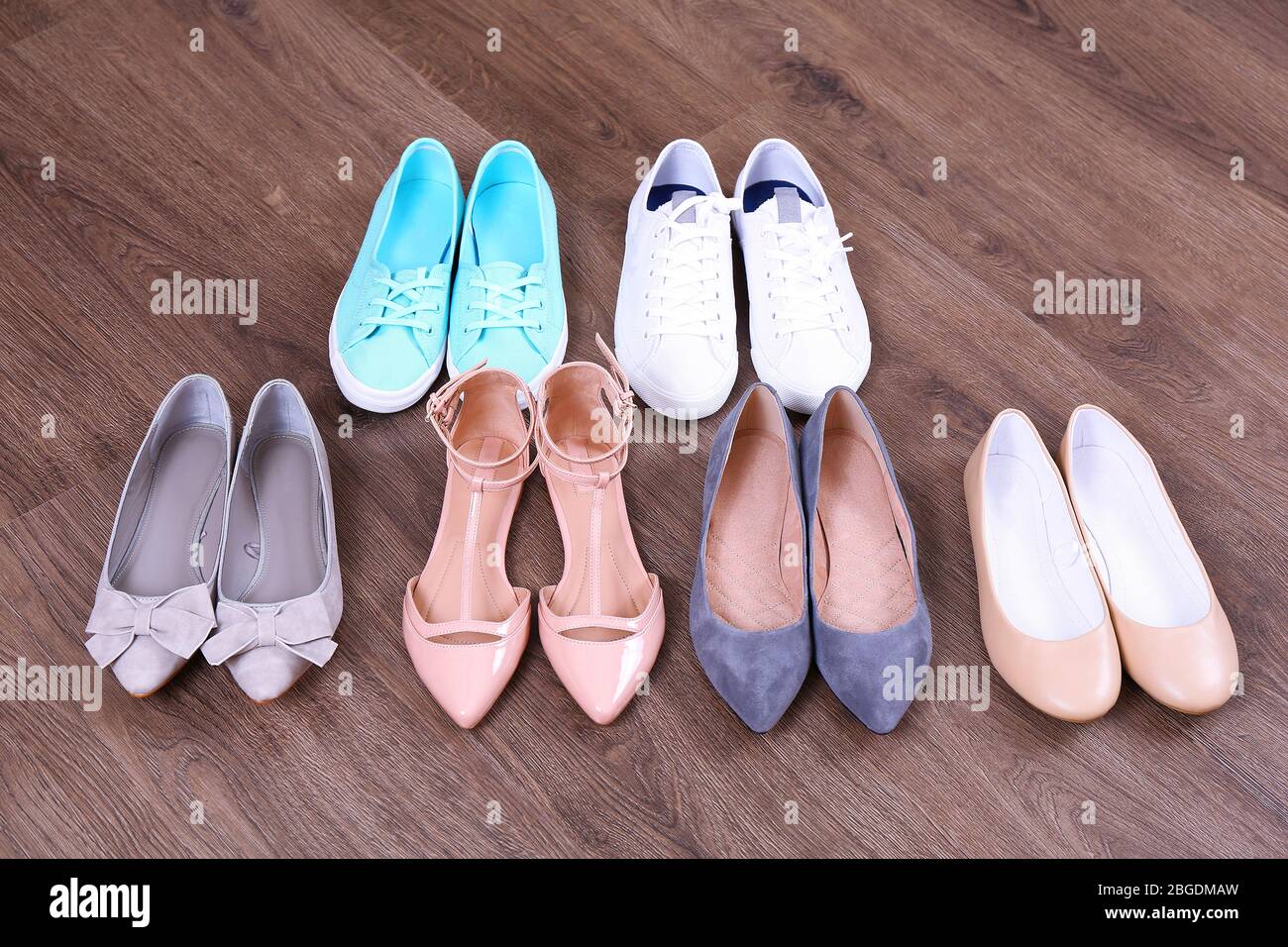 Different shoes on floor Stock Photo - Alamy