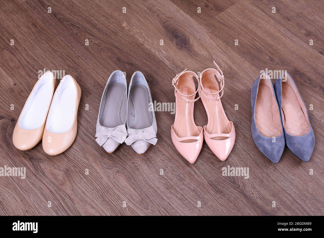 Different shoes on floor Stock Photo - Alamy