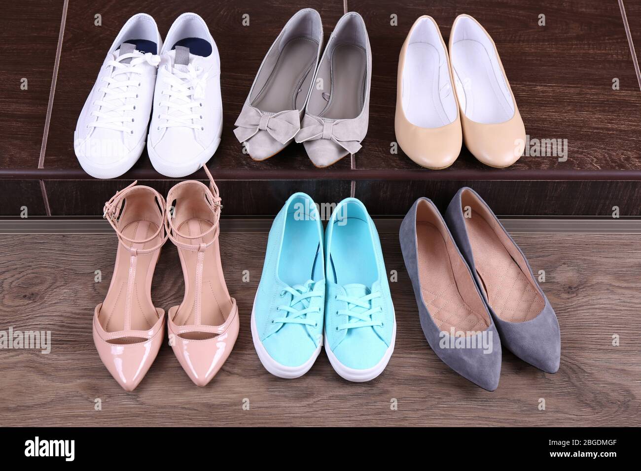 Different shoes on floor Stock Photo - Alamy