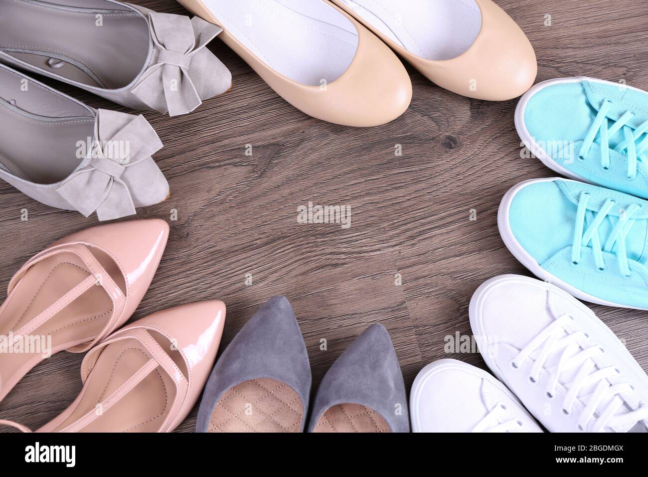Different shoes on floor Stock Photo - Alamy