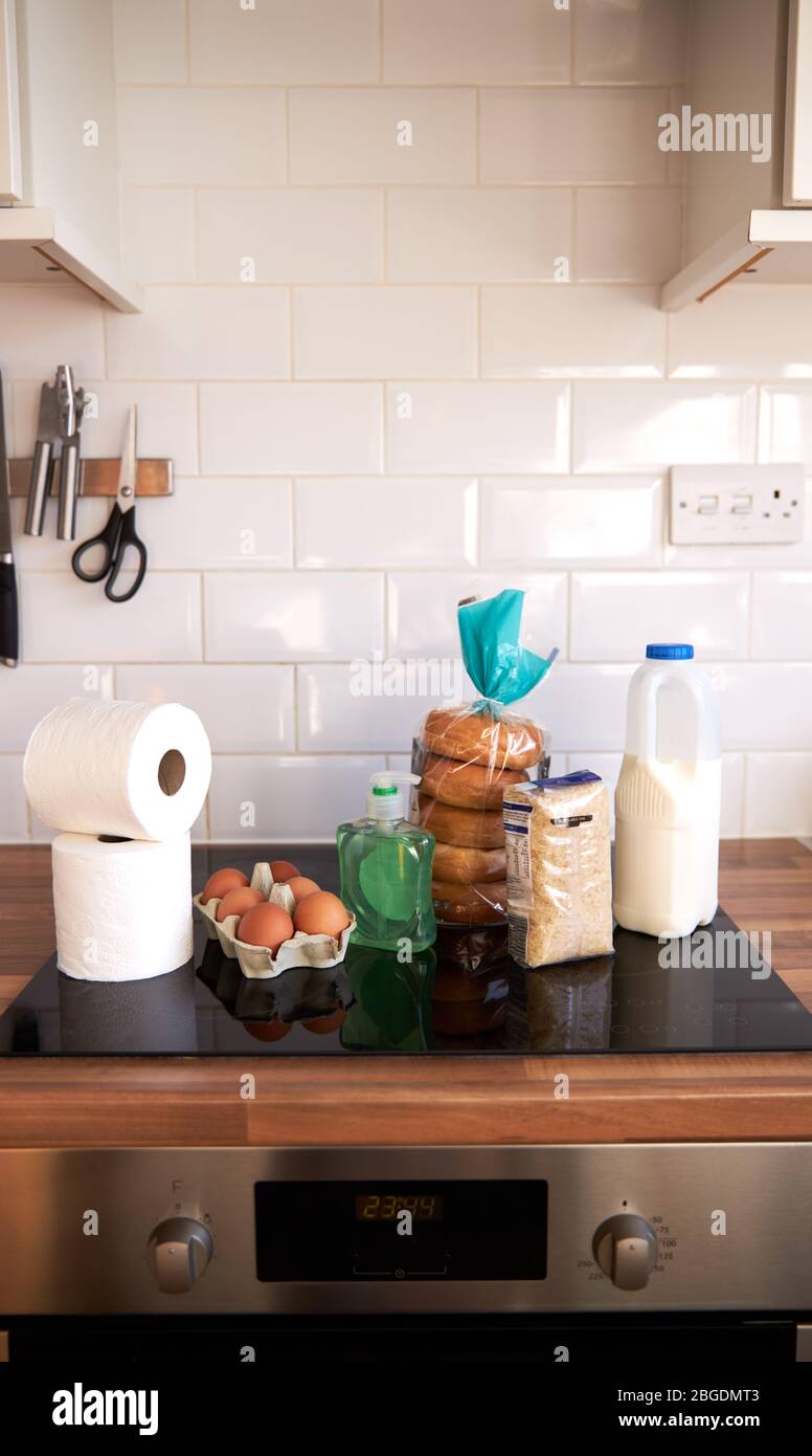 Essential food shop laid out on kitchen counter Stock Photo - Alamy