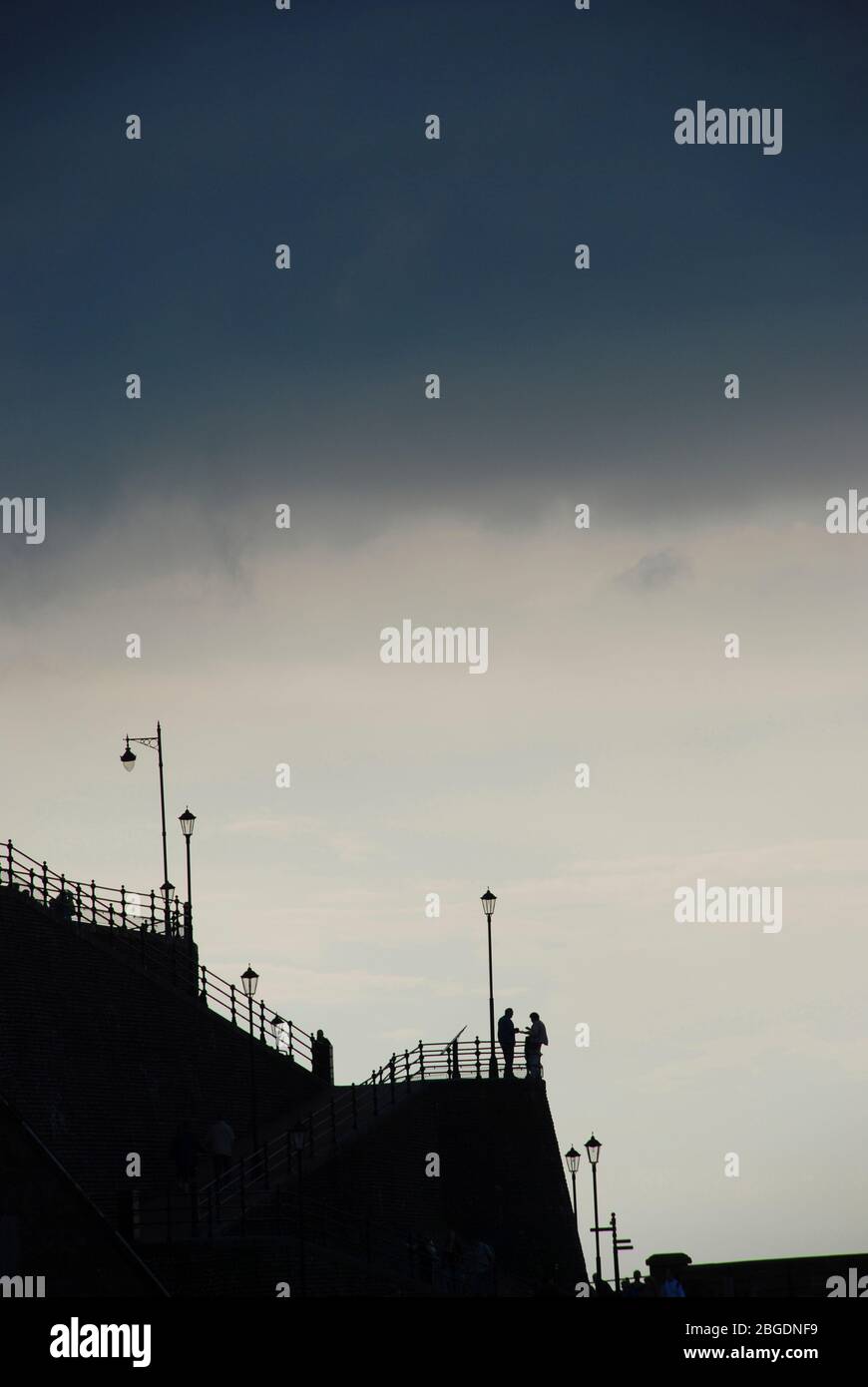 Two men talking over fence hi-res stock photography and images - Alamy