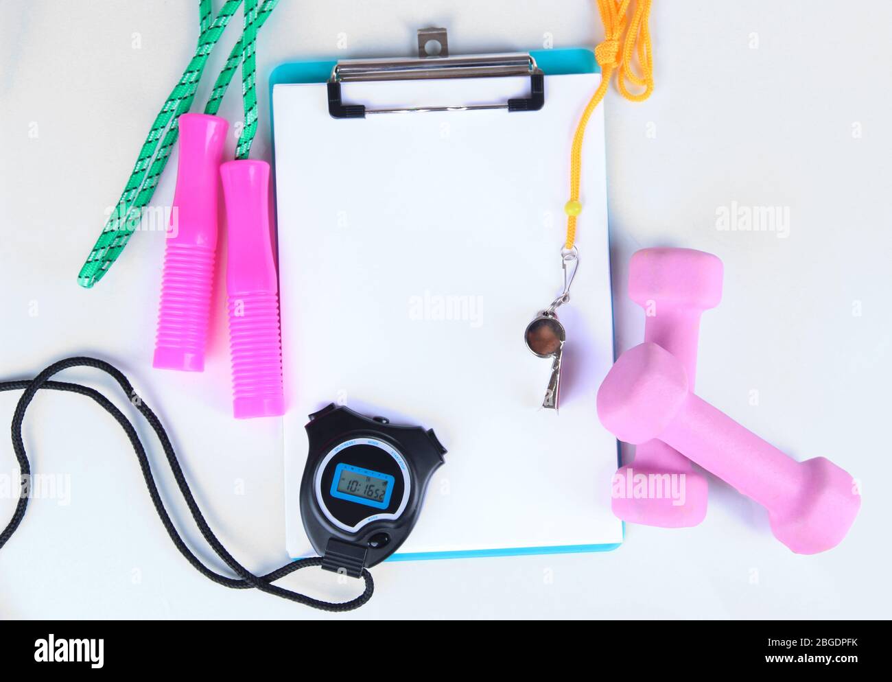 Sheet of paper and sports equipment isolated on white Stock Photo - Alamy