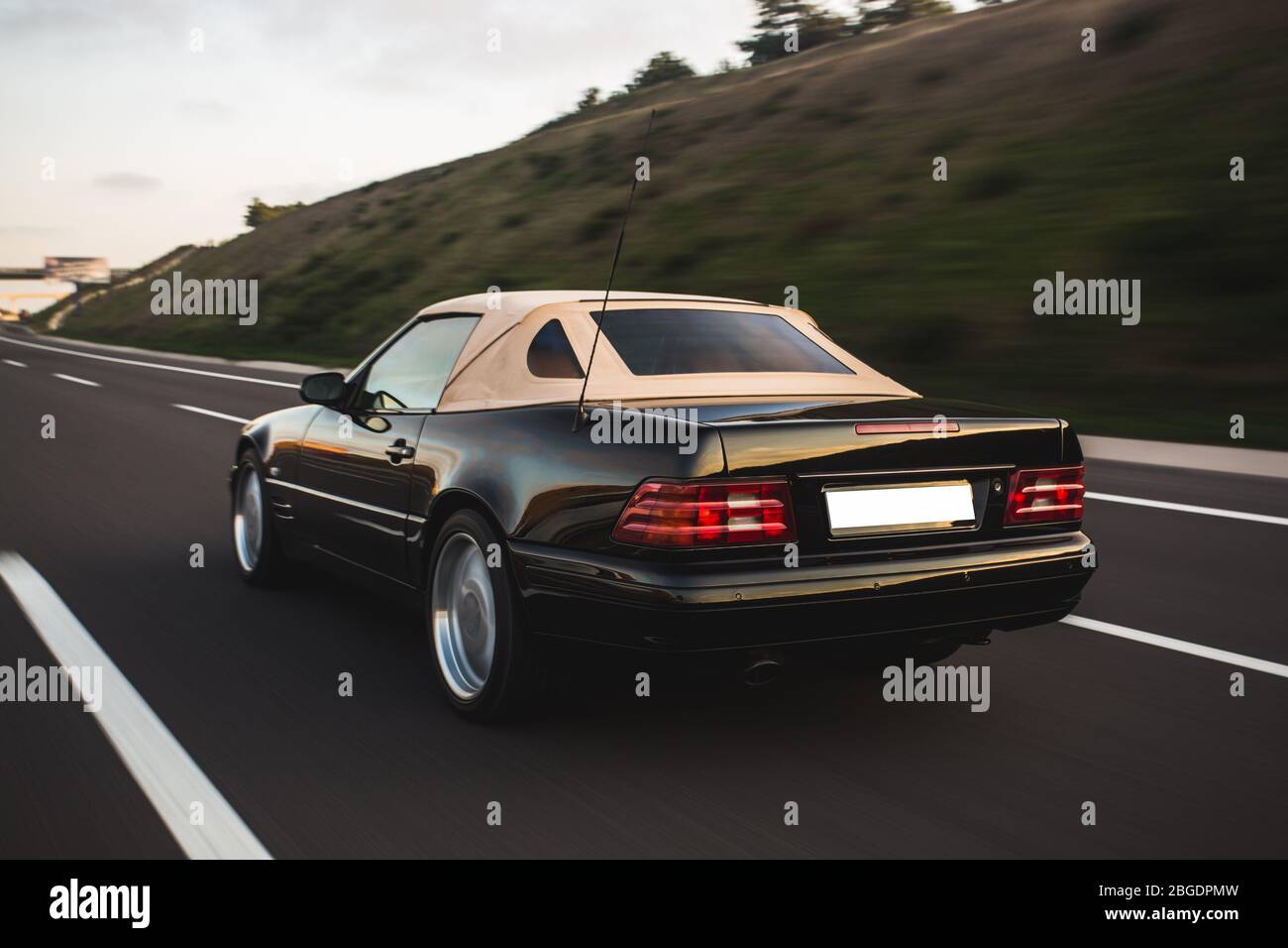 Old model sedan car in the downtown road across hills Stock Photo - Alamy