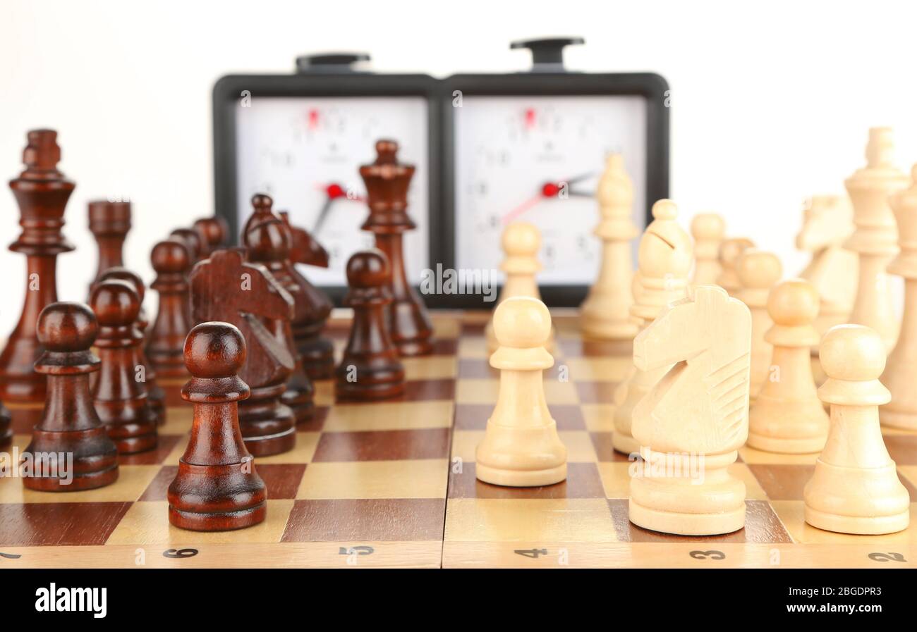 Chessboard with chess and clock, isolated on white Stock Photo - Alamy