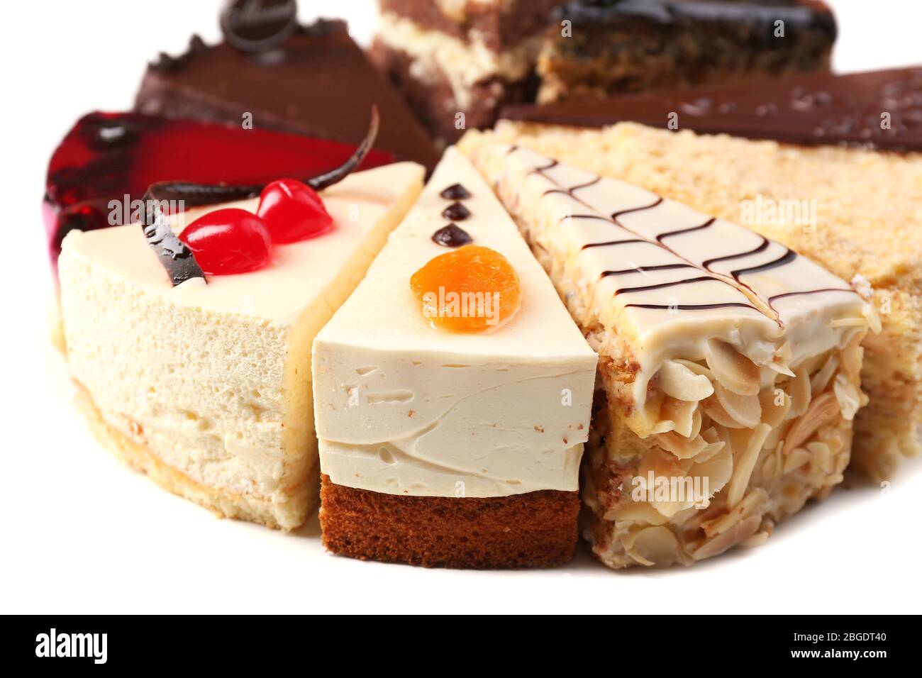 Assortment of pieces of cake, isolated on white Stock Photo - Alamy