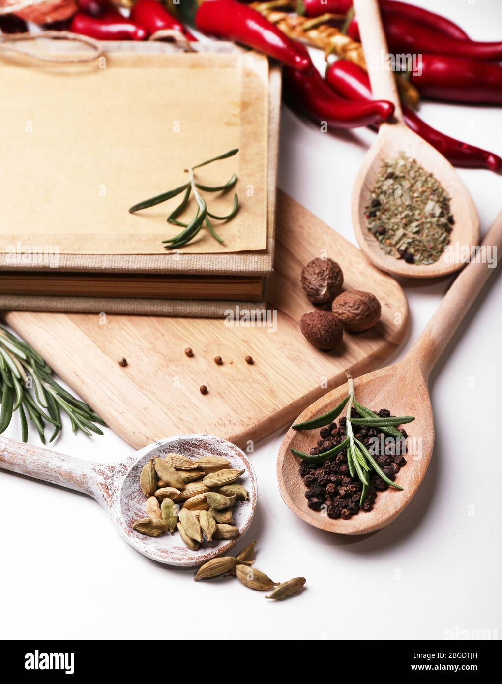 Different spices and cutting board, isolated on white Stock Photo - Alamy