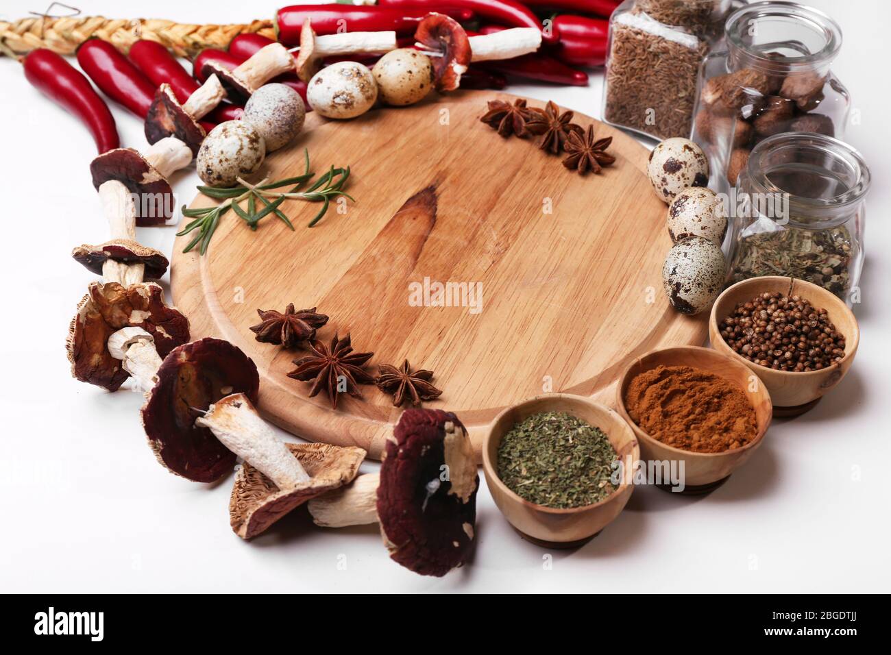 Different spices and cutting board, isolated on white Stock Photo - Alamy