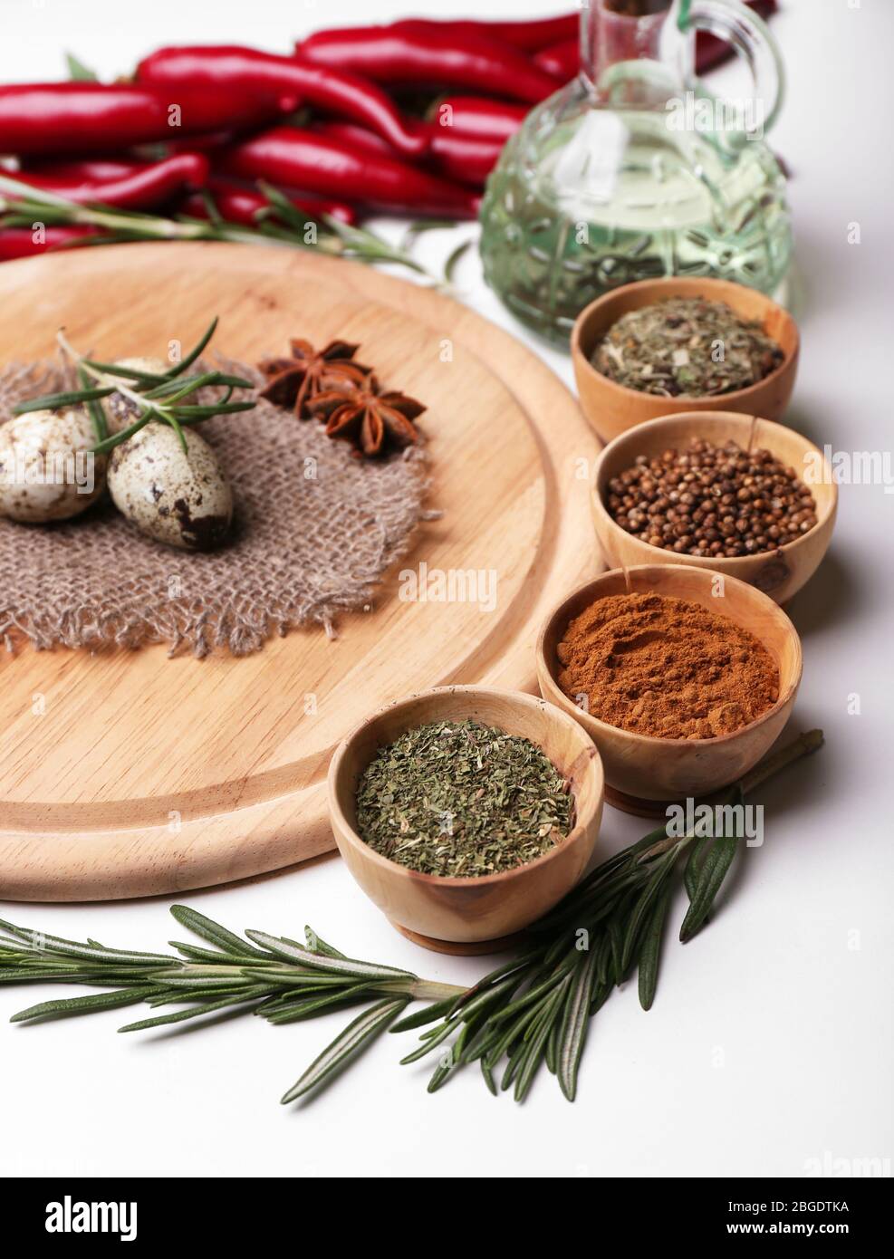 Different spices and cutting board, isolated on white Stock Photo - Alamy