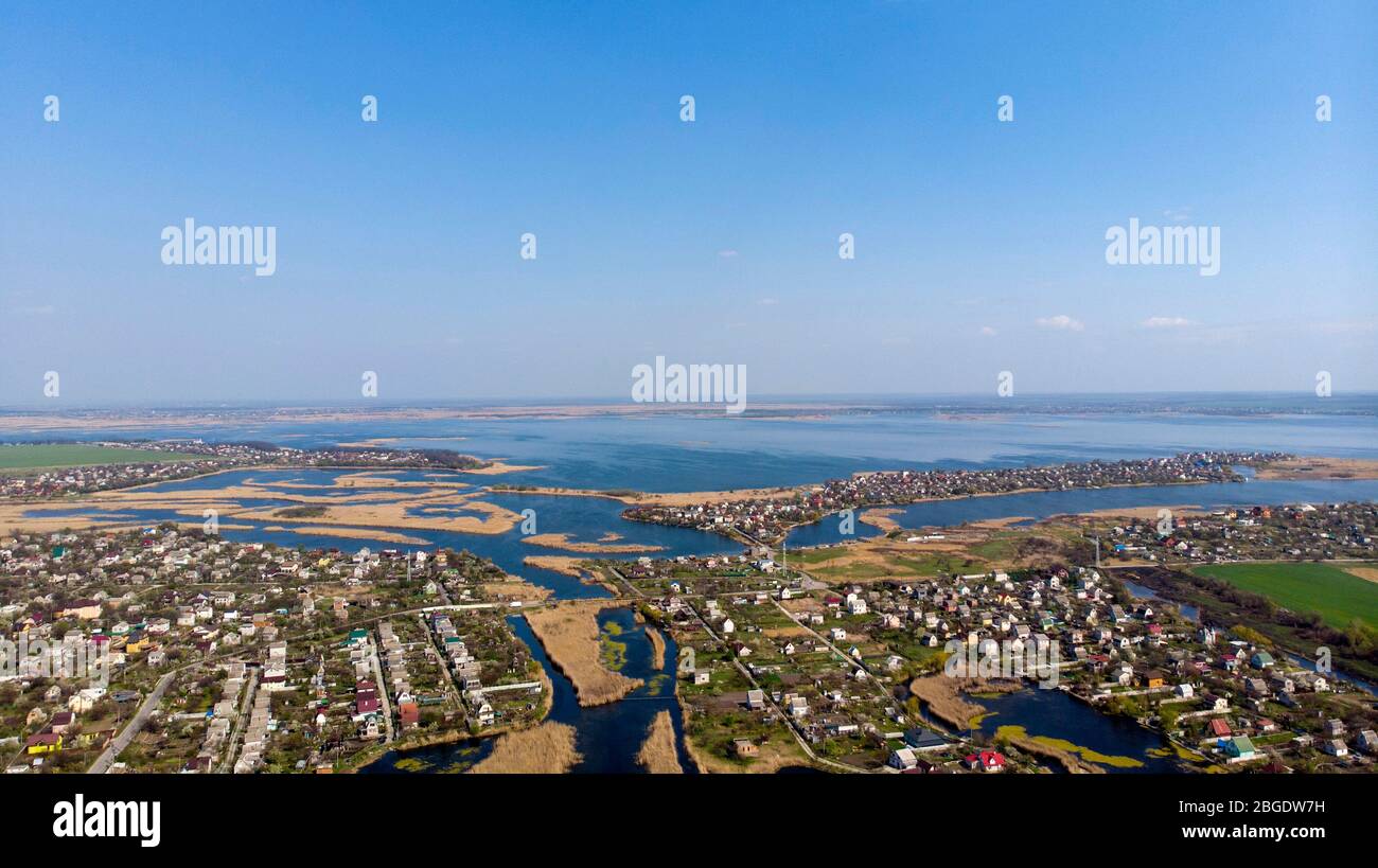 Bird's-eye view to the village, streets, roads, islands and river delta ...
